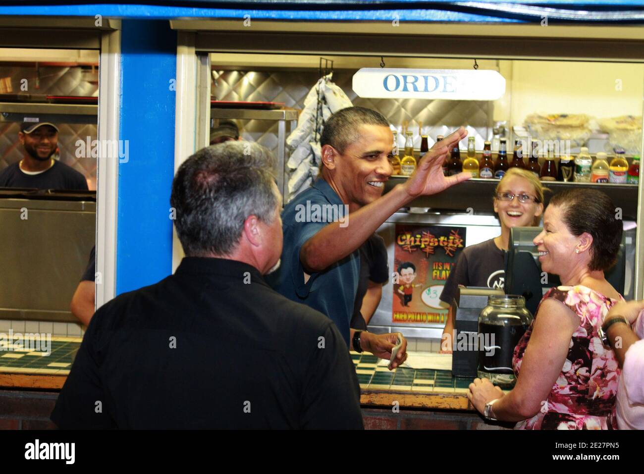 US President Barack Obama waves to the crowd in front of the takeout ...