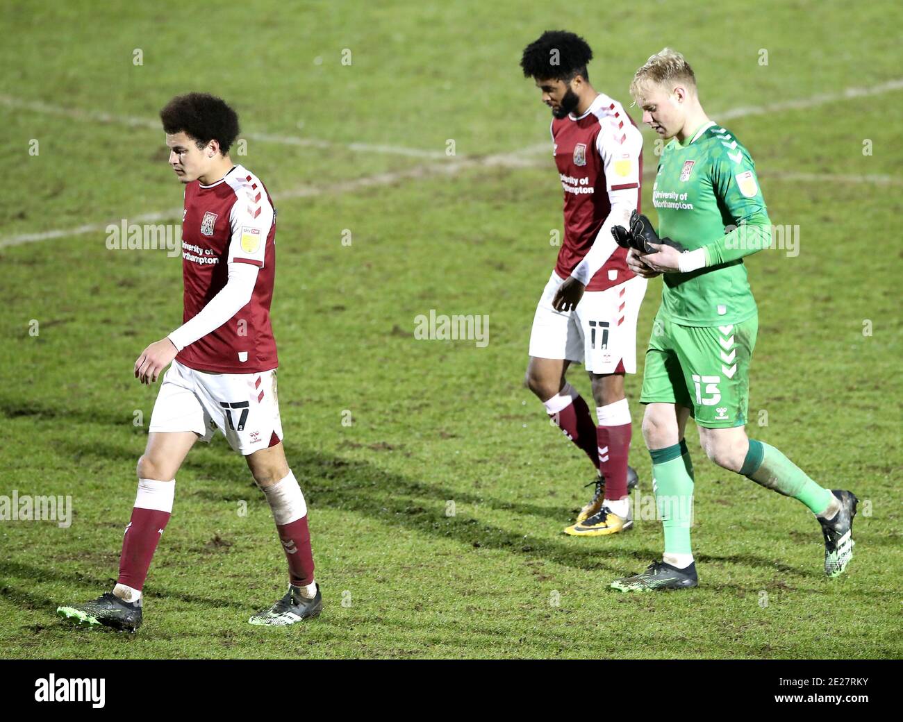 Northampton Town's Shaun McWilliams (left), Ricky Korboa and goalkeeper ...