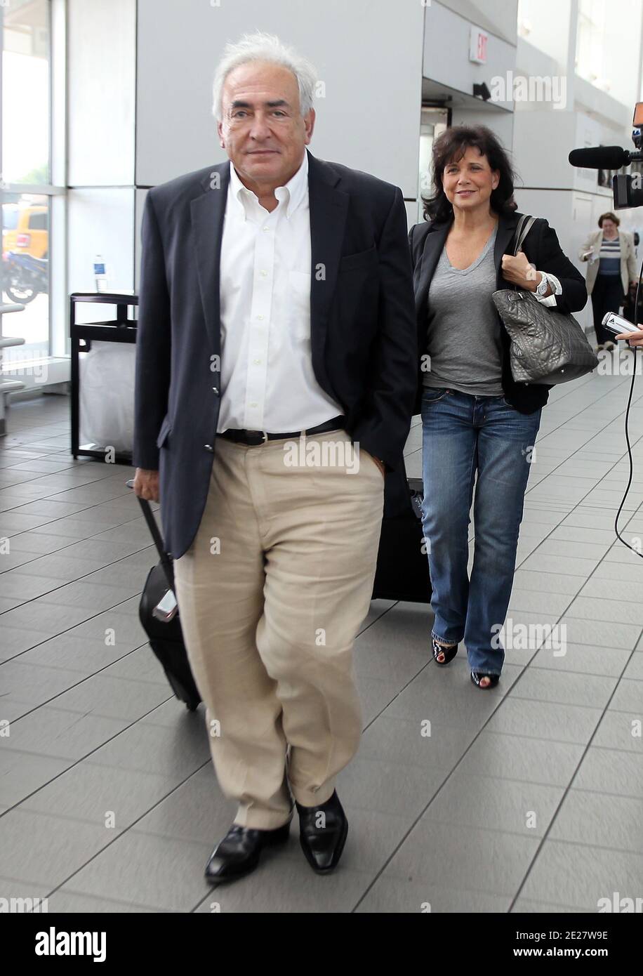 Dominique Strauss-Kahn and his wife Anne Sinclair leave their townhouse ...