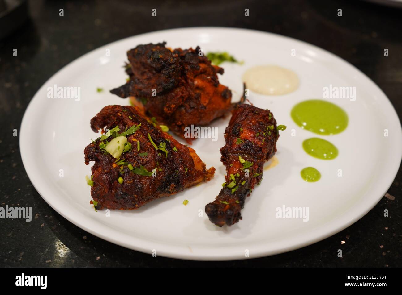 Grilled chicken place with sausage Stock Photo - Alamy