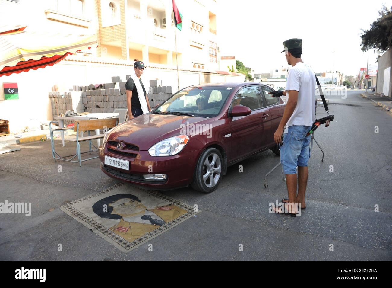 Libyan rebel seen controlling the streets of Tripoli, Libya, on ...