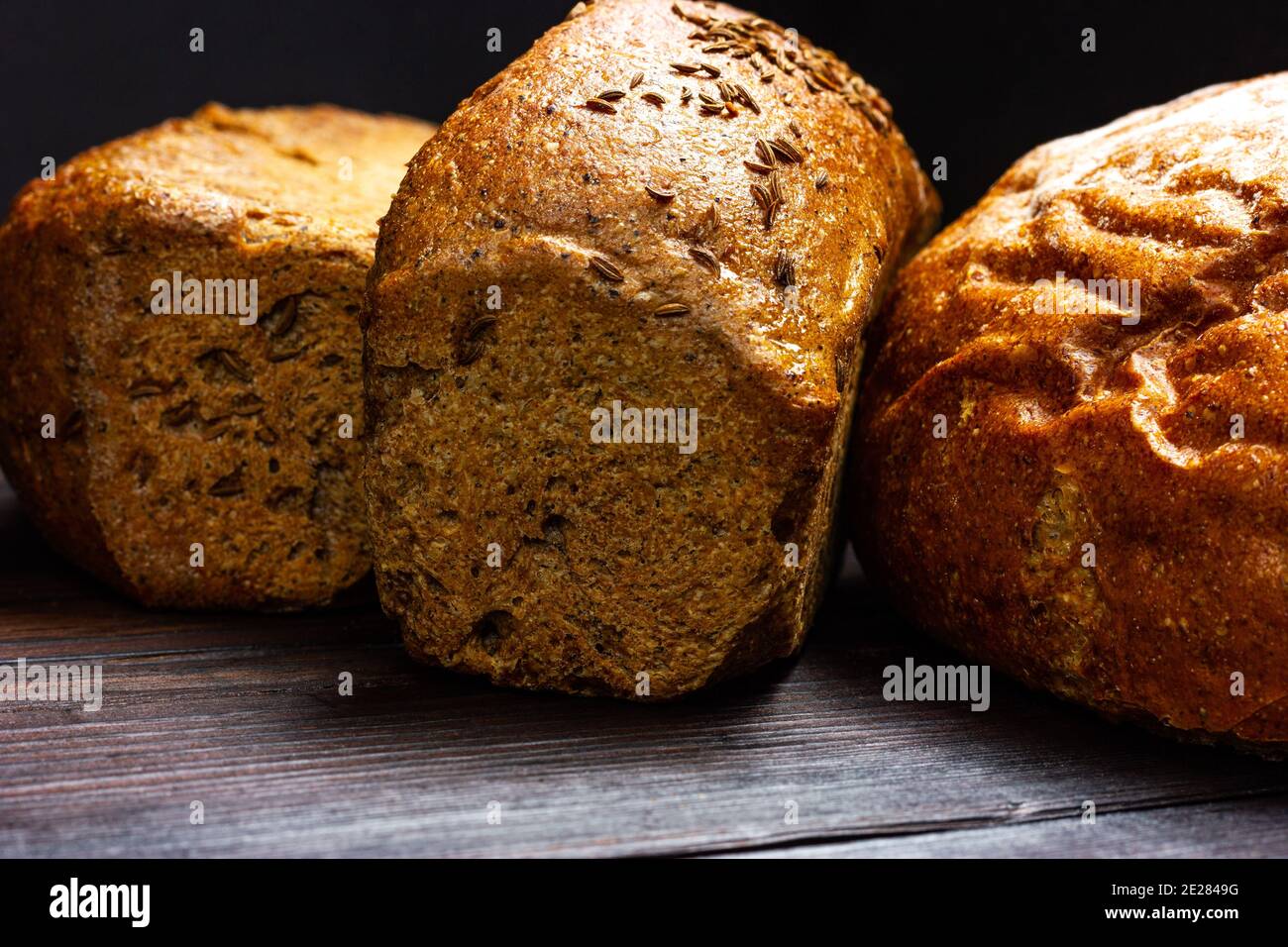 Bread on display in a bakery store. Fresh rye bread in rustic style ...