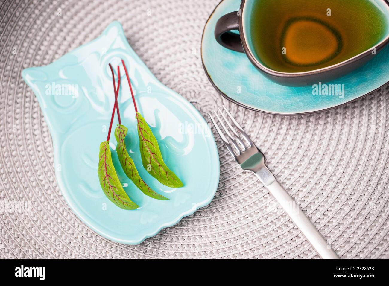Three chard leaves and lemon tea. Humor diet concept, top view Stock ...