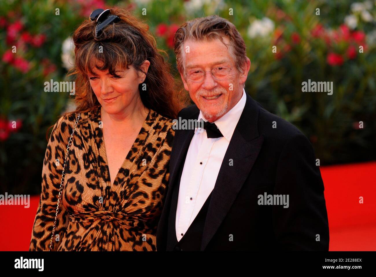 Anwen Rees Meyers and John Hurt arriving at the 'Tinker, Tailor ...