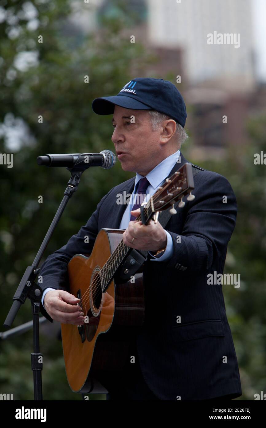 Paul Simon performs during tenth anniversary ceremonies at the site of ...