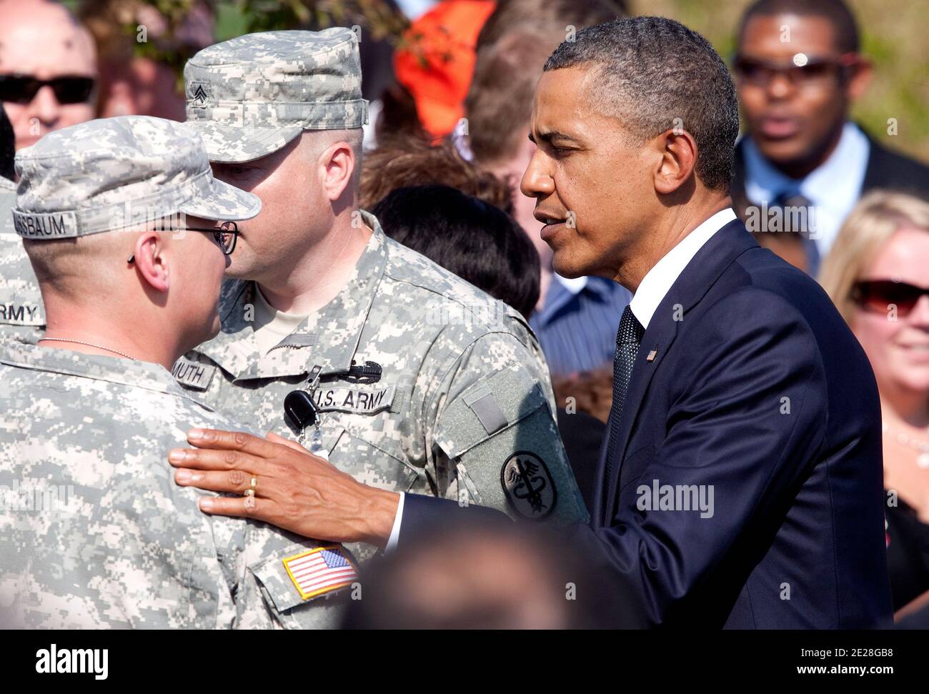 U.S. President Barack Obama greets soldiers during a remembrance ...