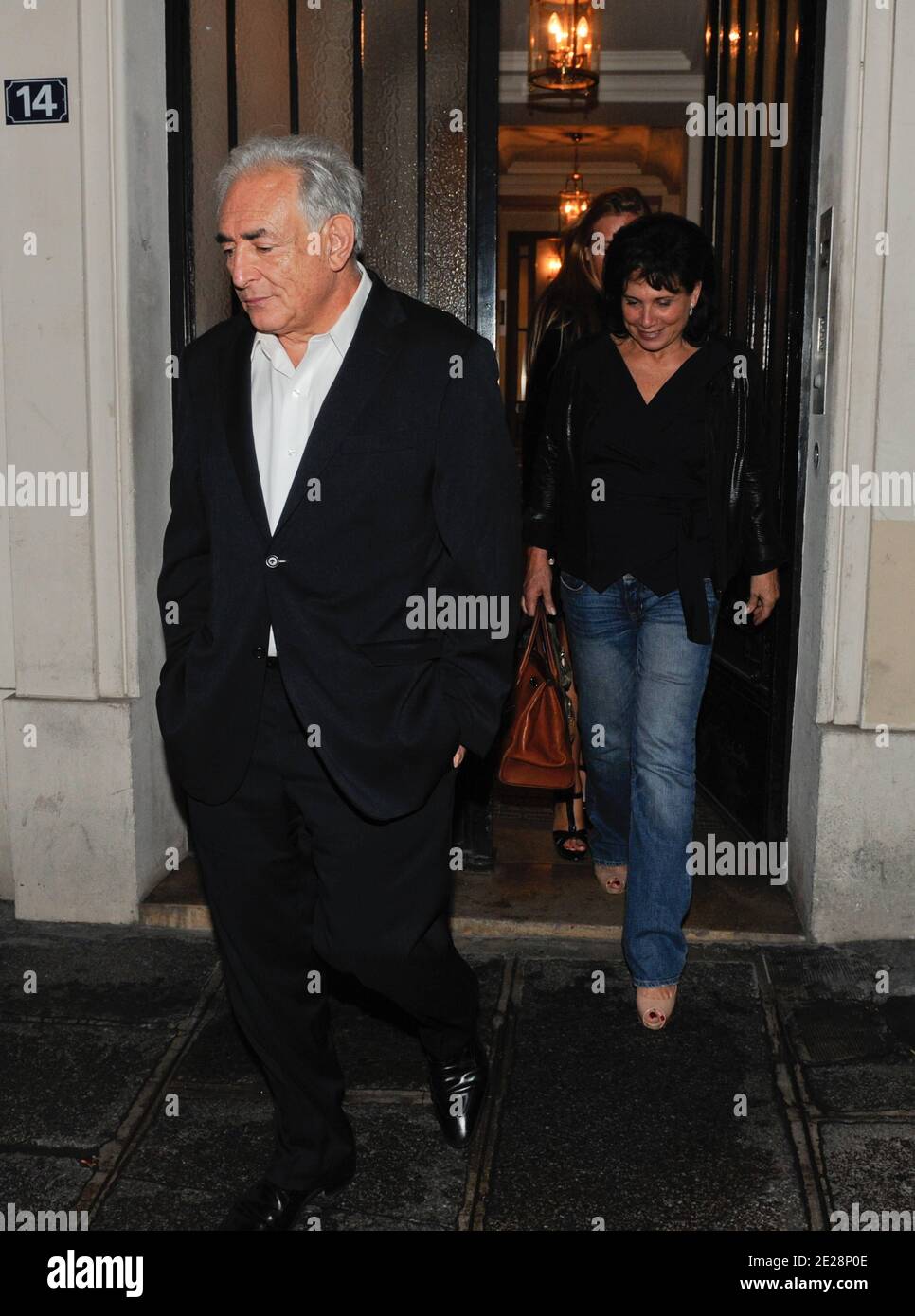 Dominique Strauss-Kahn and his wife Anne Sinclair leaving a building ...