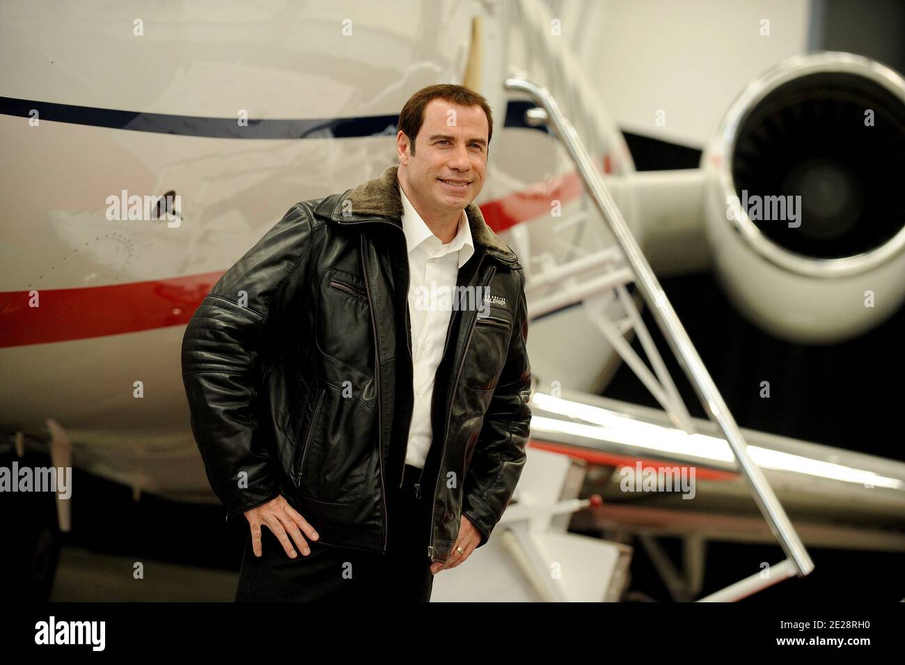 John Travolta unveils the new line of Bombardier's business aircraft at ...