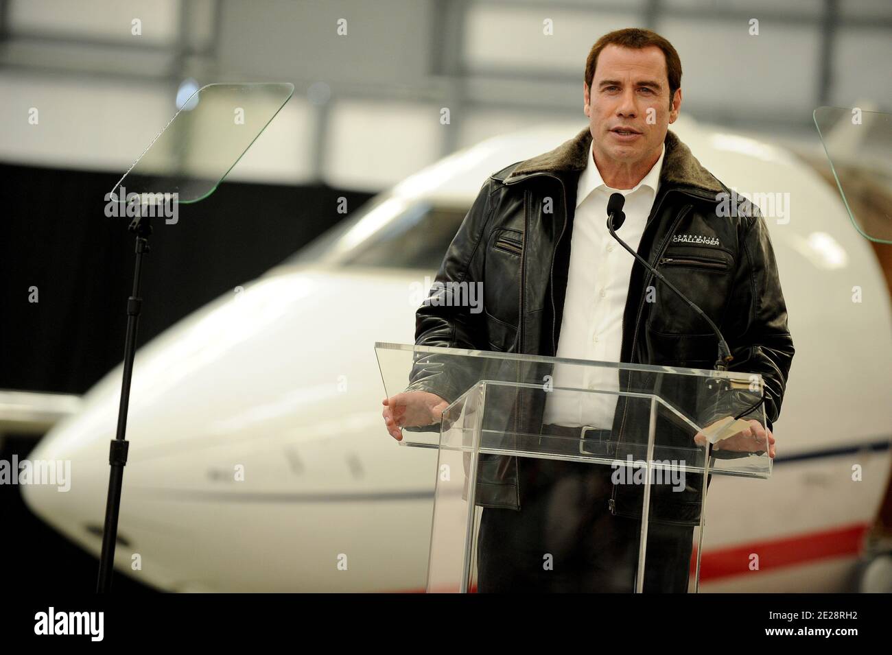 John Travolta unveils the new line of Bombardier's business aircraft at ...