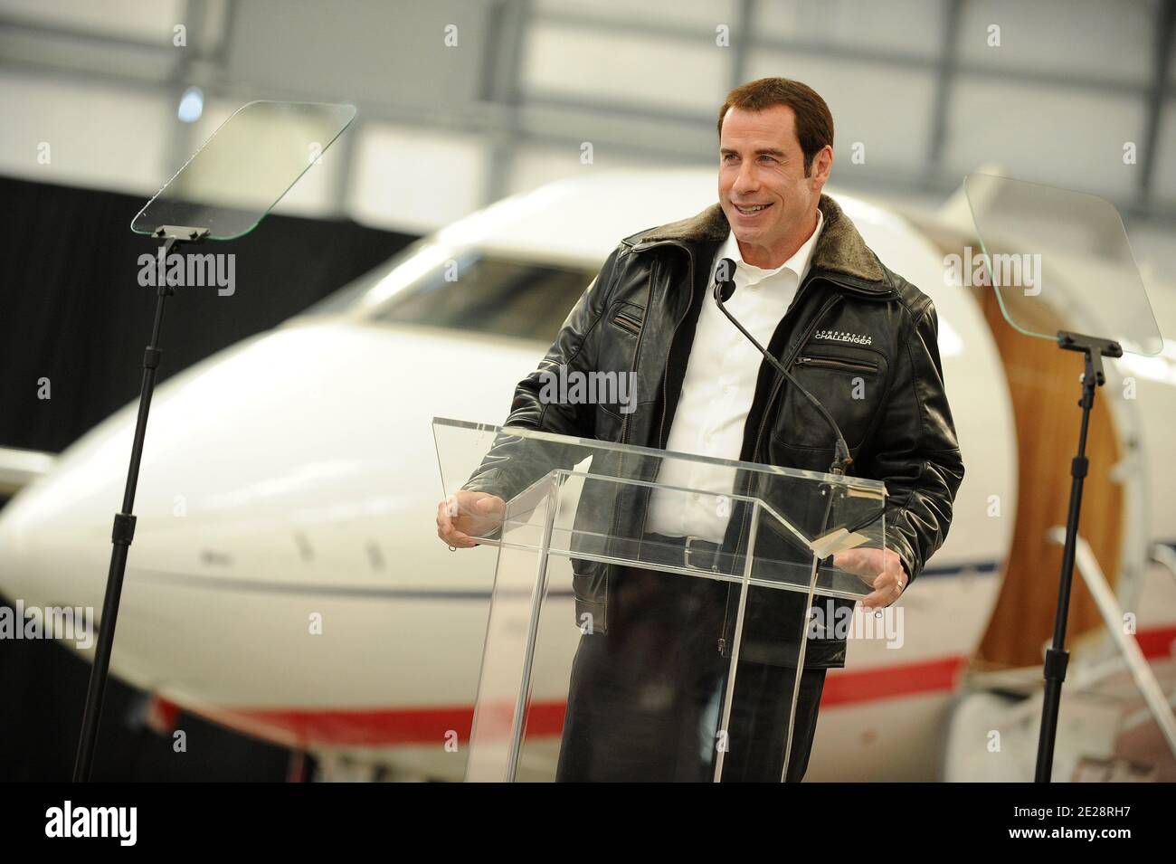John Travolta unveils the new line of Bombardier's business aircraft at ...