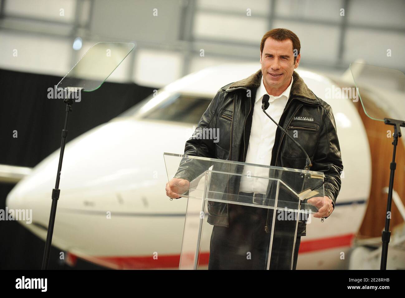 John Travolta unveils the new line of Bombardier's business aircraft at ...