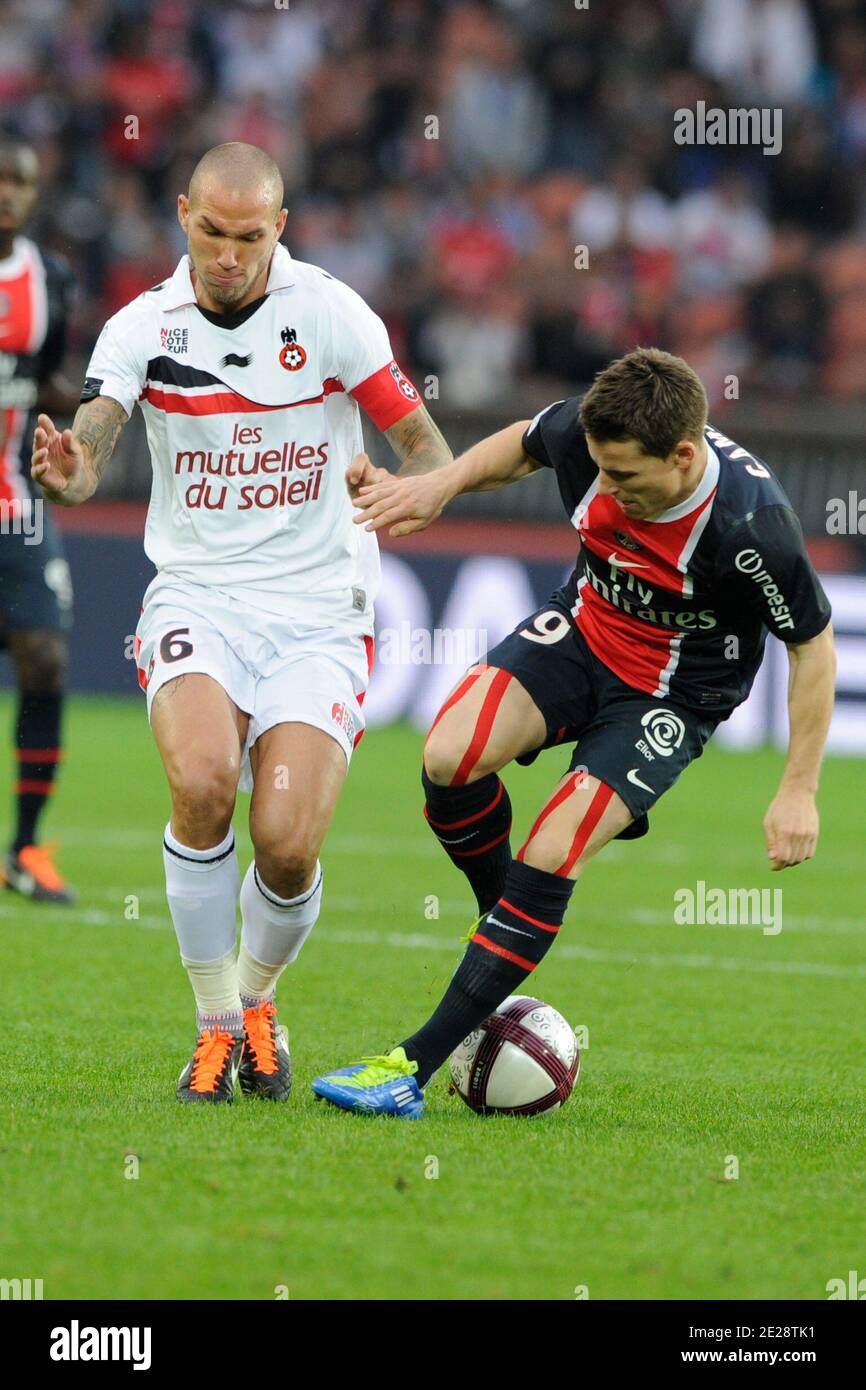 PSG's Kevin Gameiro battling Nice's Didier Digard during the French ...