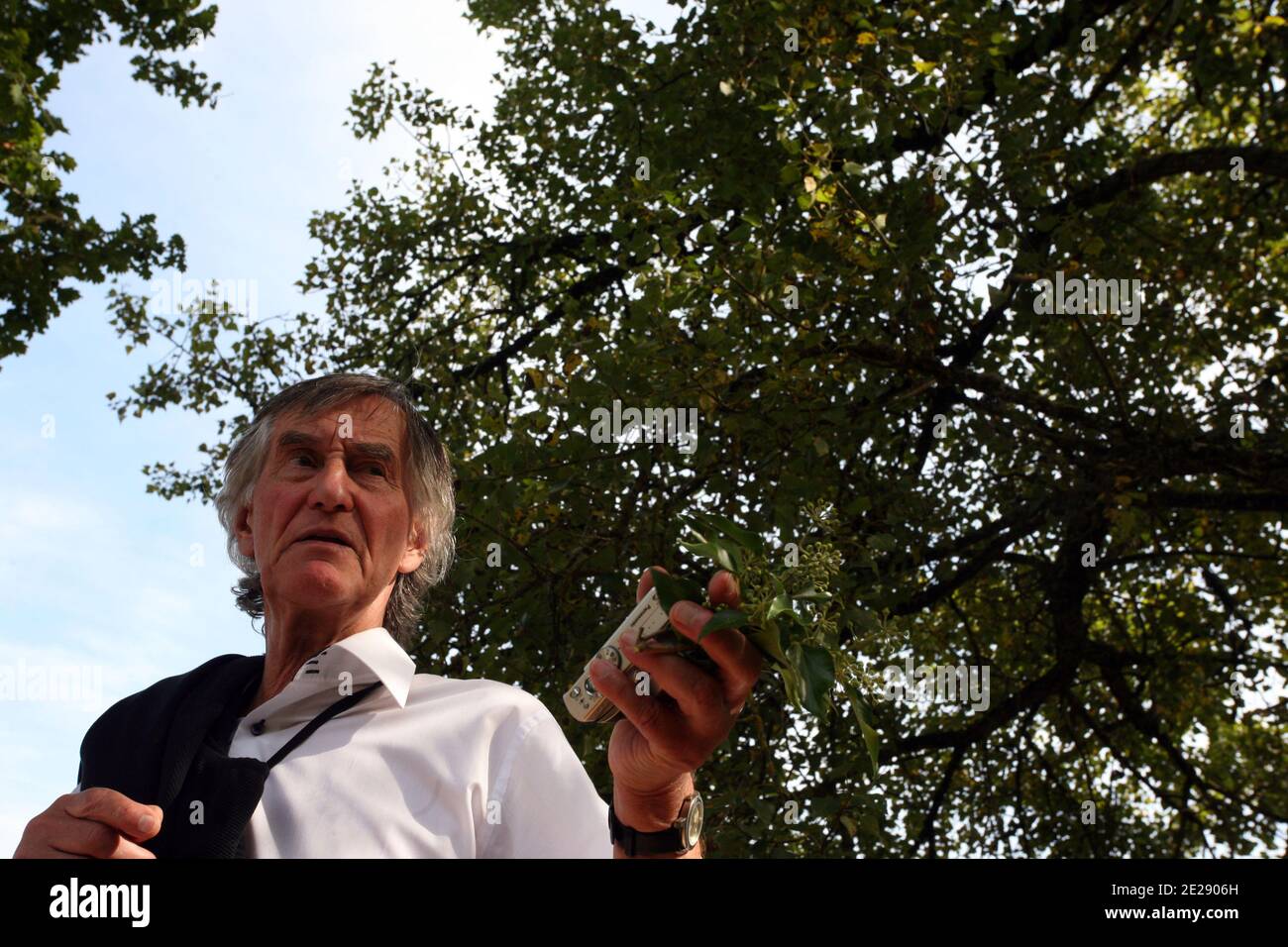 German artist Nils Udo, representative of the Land Art movement, posing ...