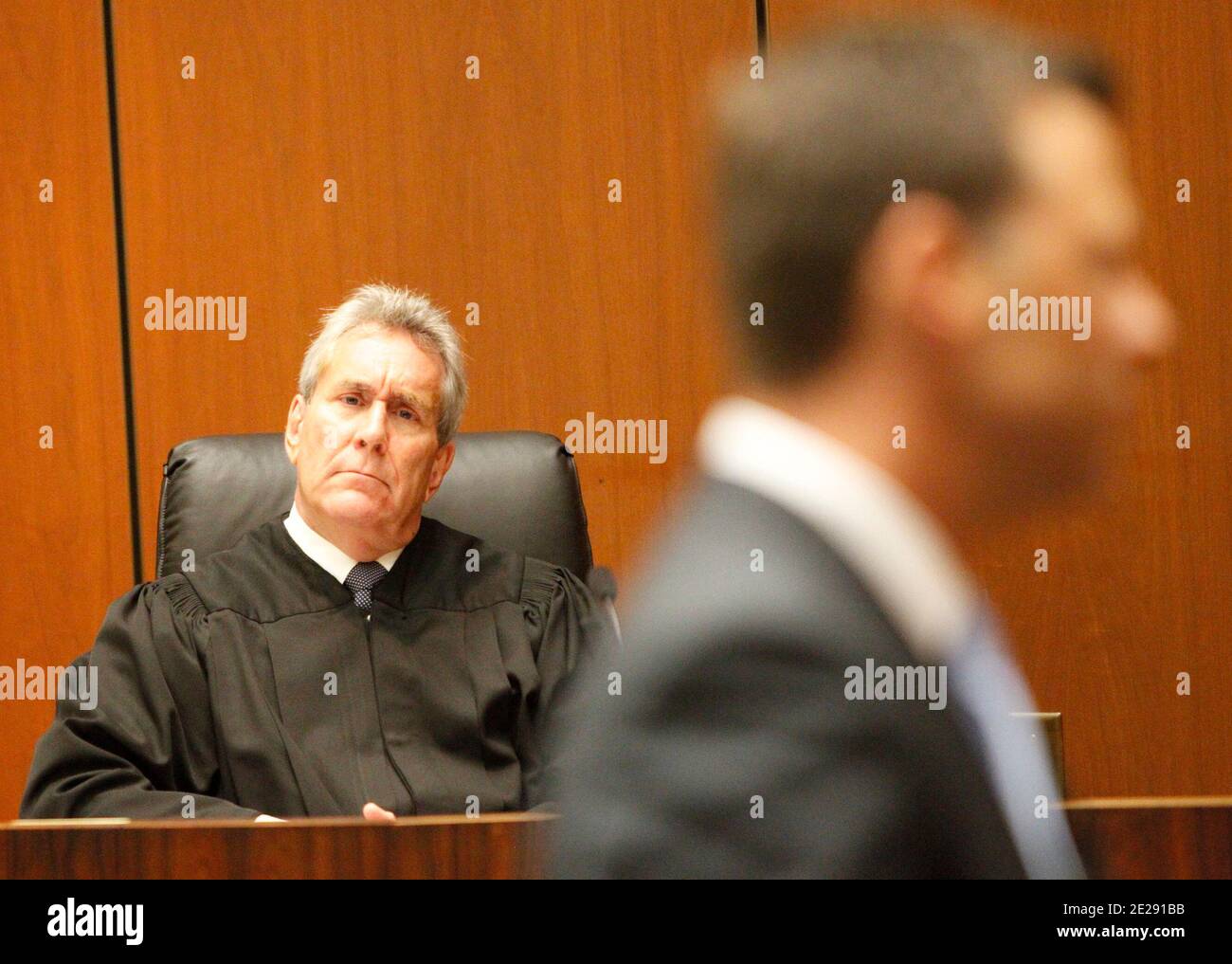 Judge Michael E. Pastor listens to opening arguments by Deputy District ...