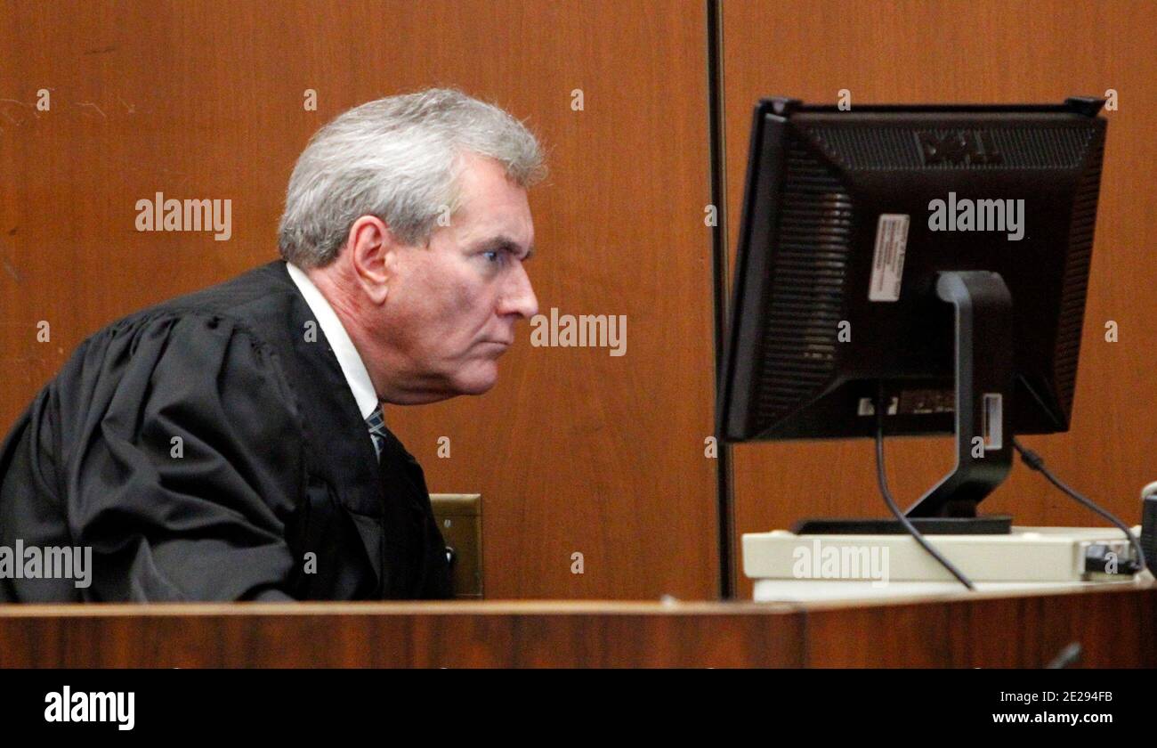 Judge Michael E. Pastor looks at a computer screen during the Conrad ...