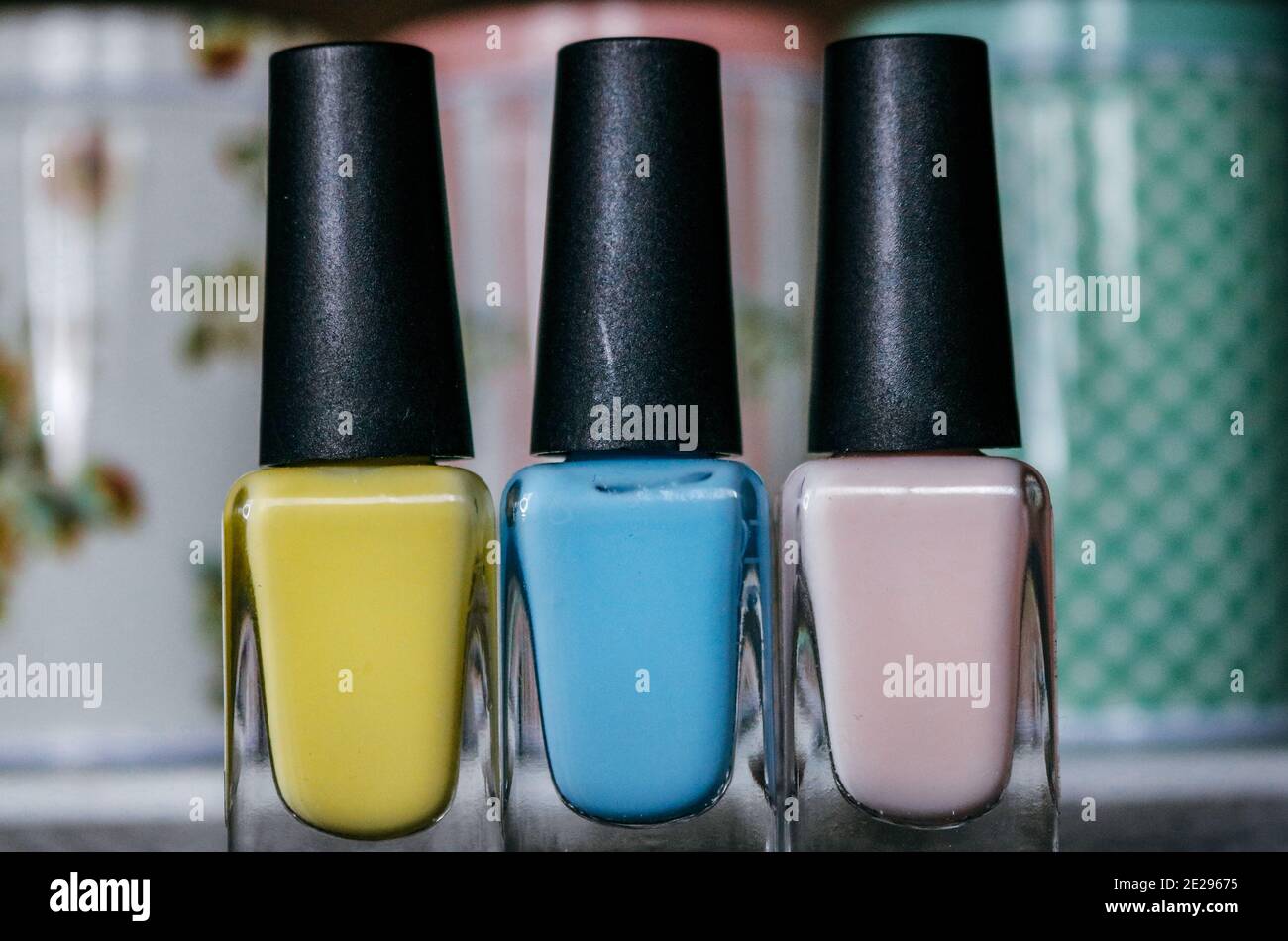 Pastel nail polish in 3 colors Stock Photo - Alamy