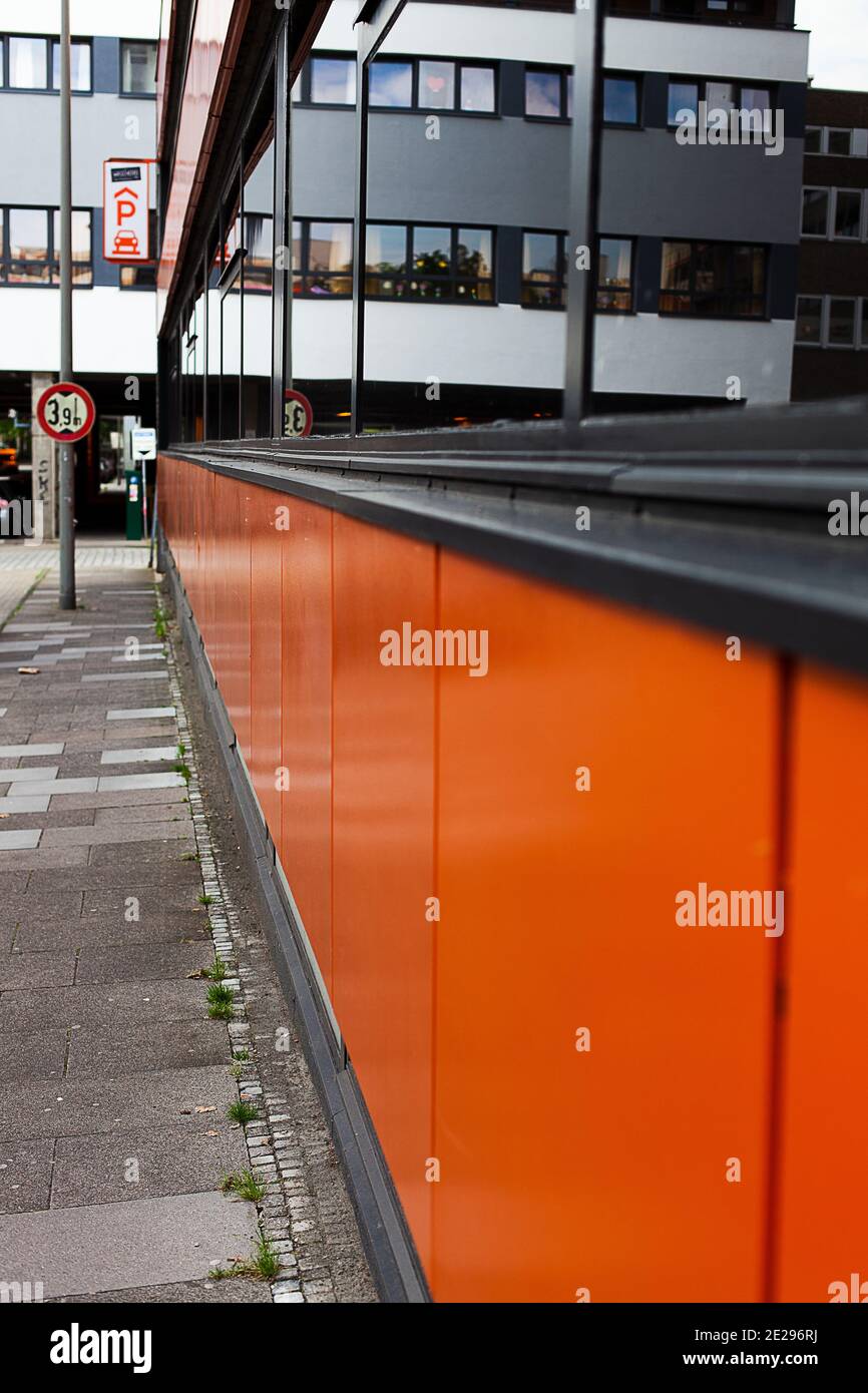 Building reflected in window with sidewalk Stock Photo - Alamy
