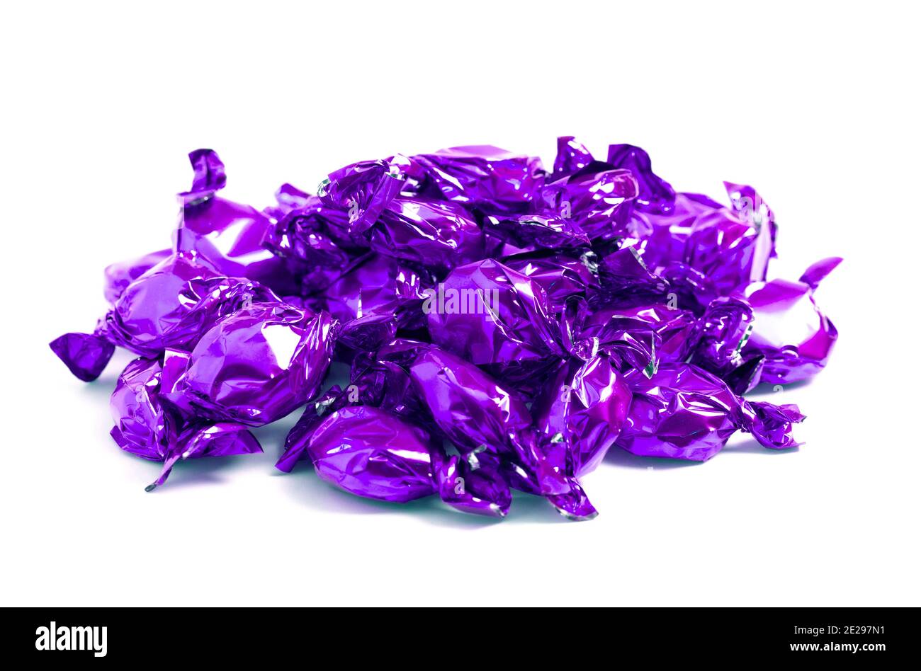 A Pile of Purple Wrapped Candy Isolated on a White Background Stock ...