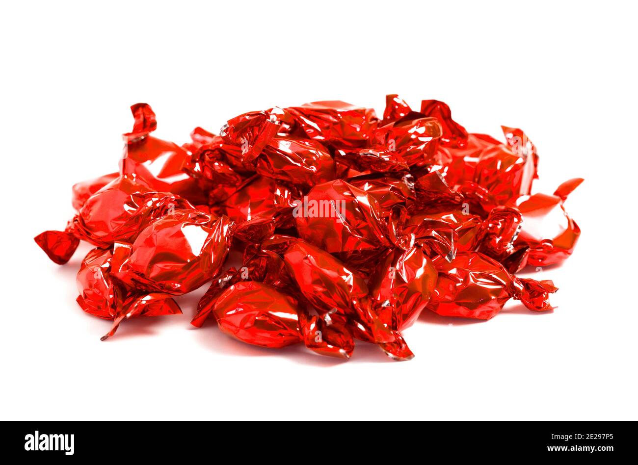 A Pile of Red Wrapped Candy Isolated on a White Background Stock Photo ...