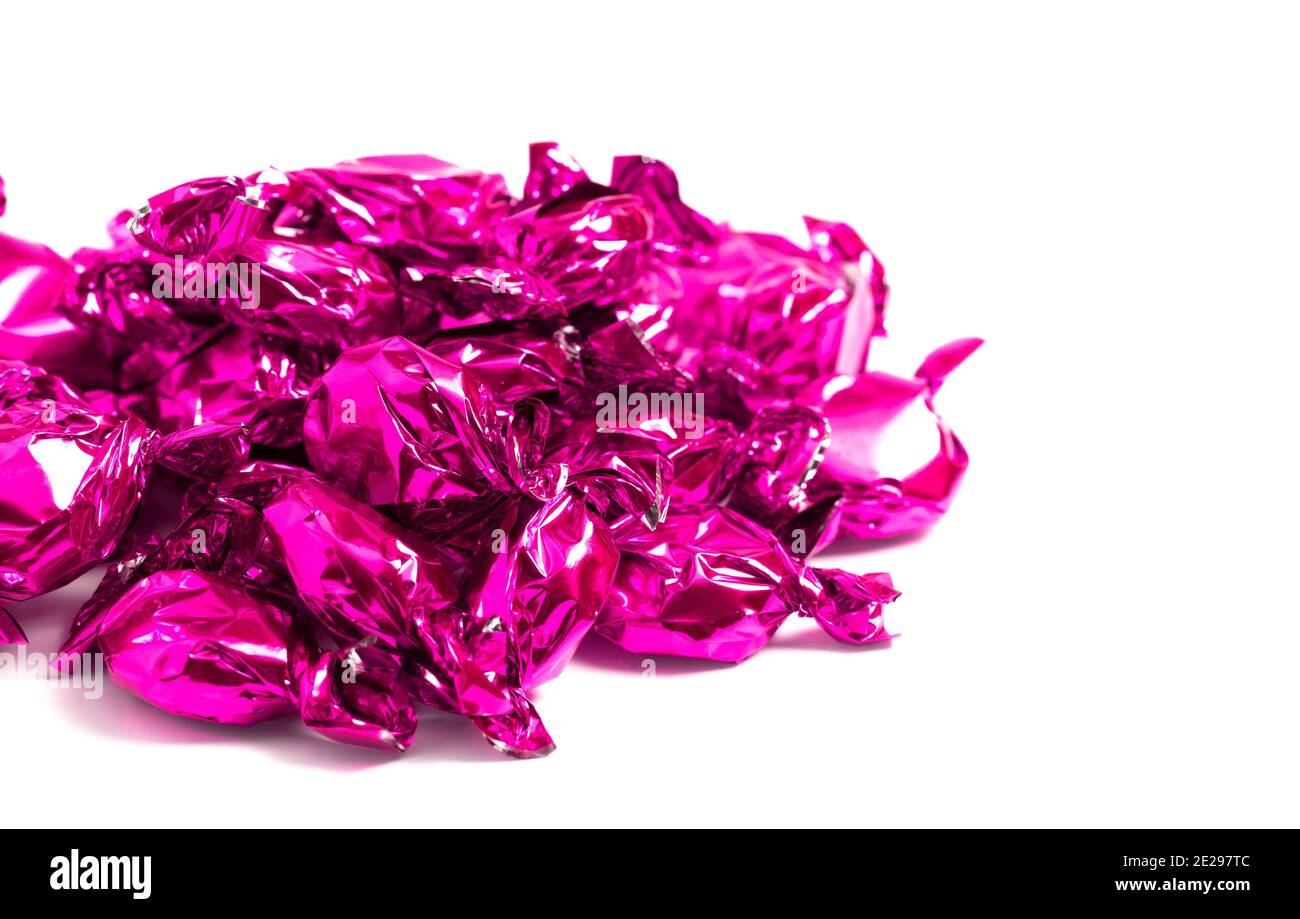 A Pile of Pink Wrapped Candy Isolated on a White Background Stock Photo ...