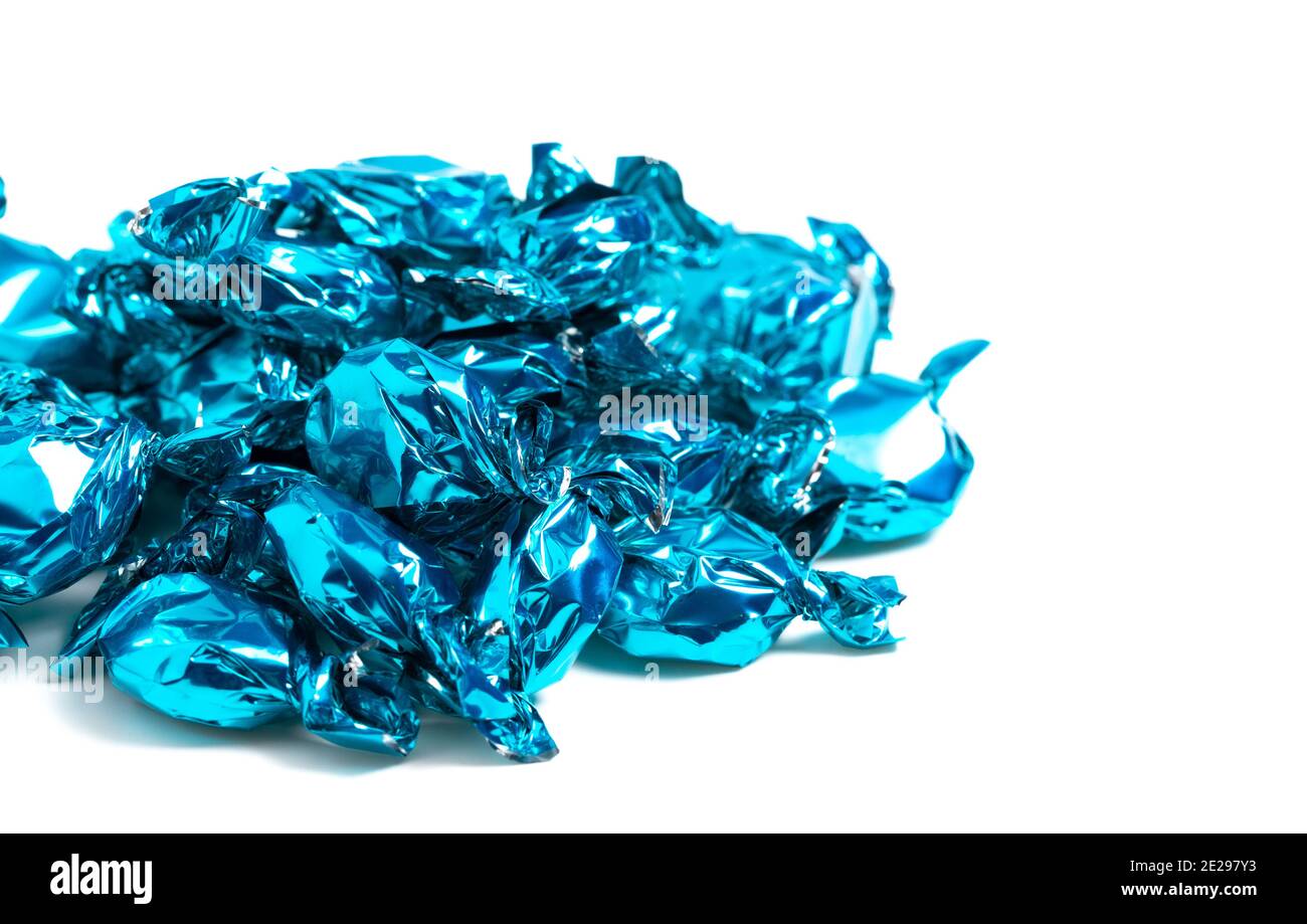 A Pile of Blue Wrapped Candy Isolated on a White Background Stock Photo ...