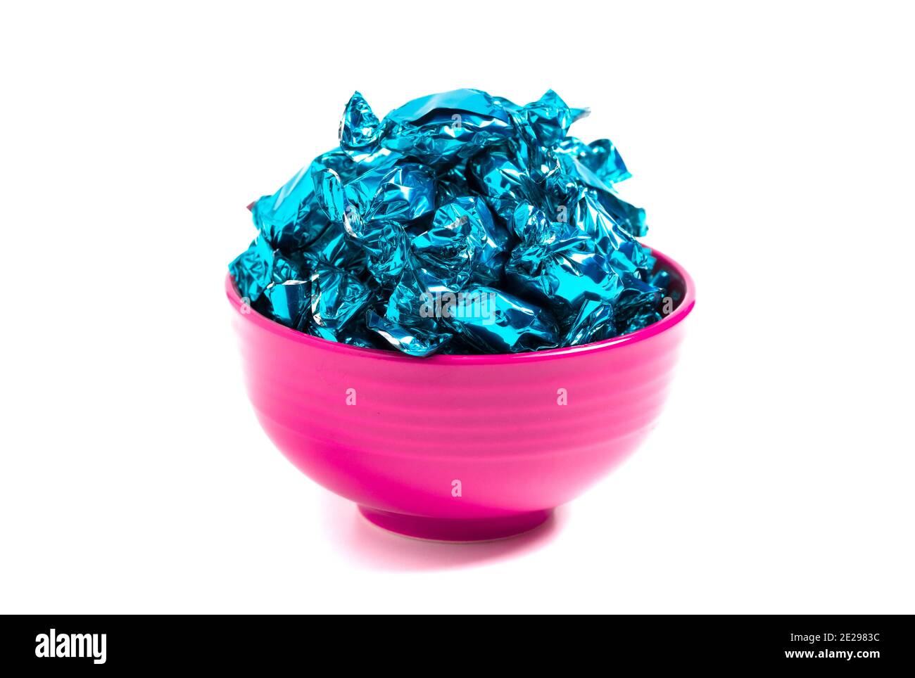 A Bowl of Blue Wrapped Candy Isolated on a White Background Stock Photo ...