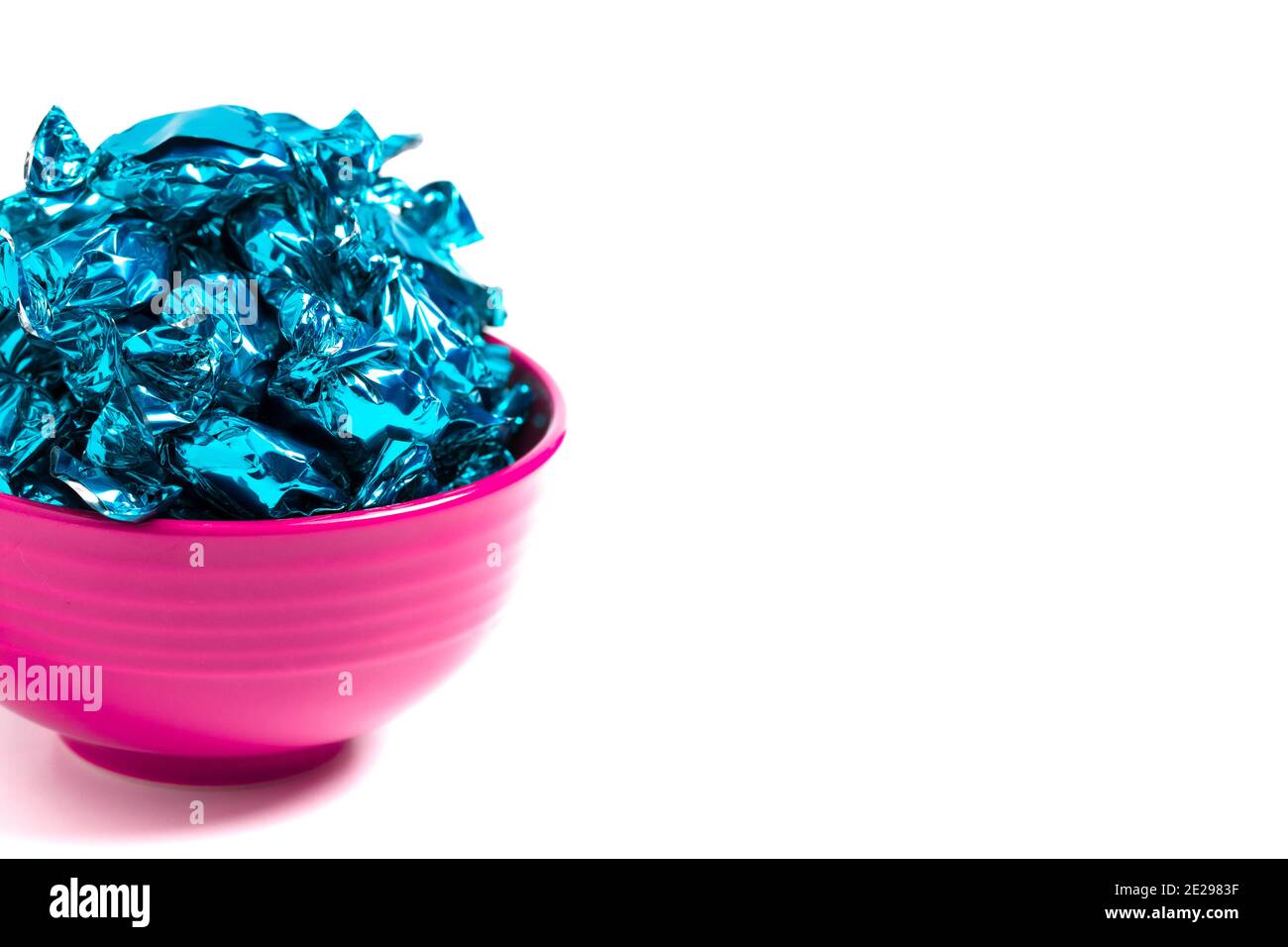 A Bowl of Blue Wrapped Candy Isolated on a White Background Stock Photo ...
