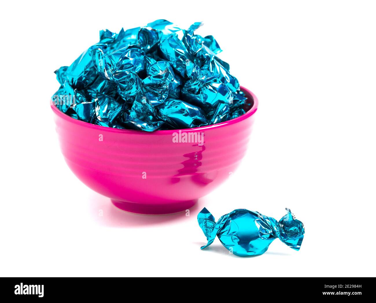 A Bowl of Blue Wrapped Candy Isolated on a White Background Stock Photo ...