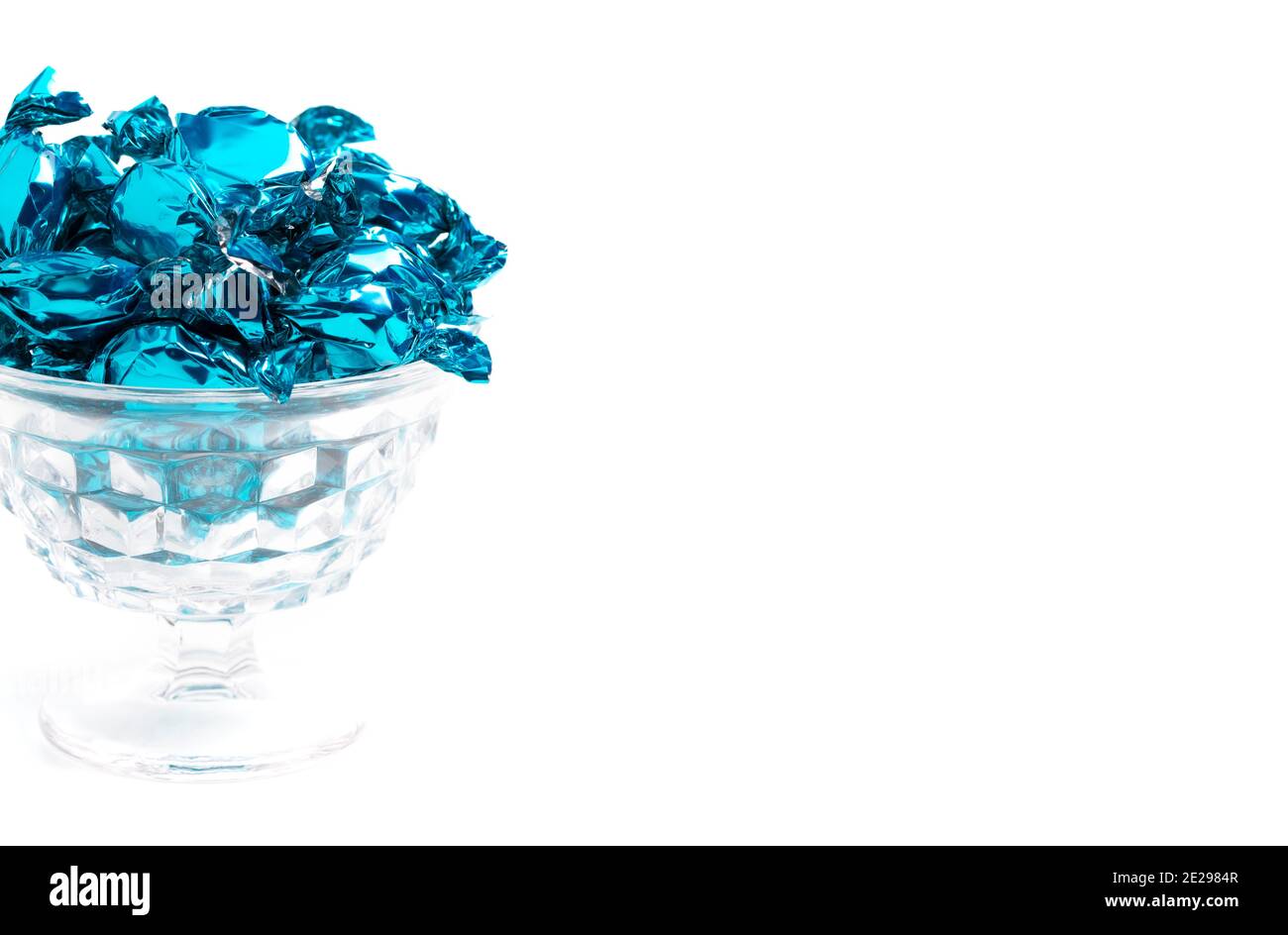 A Bowl of Blue Wrapped Candy Isolated on a White Background Stock Photo ...
