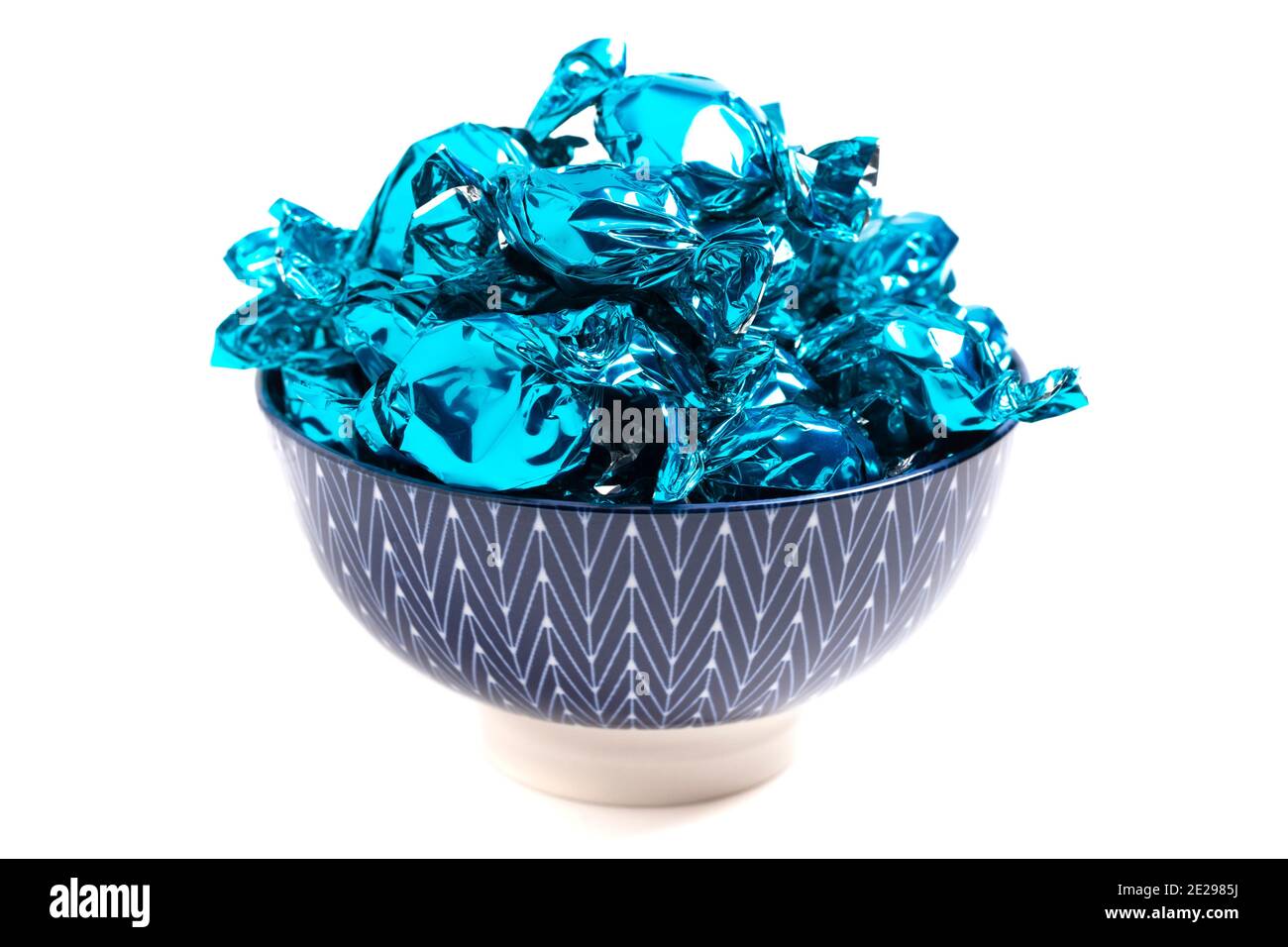 A Bowl of Blue Wrapped Candy Isolated on a White Background Stock Photo ...
