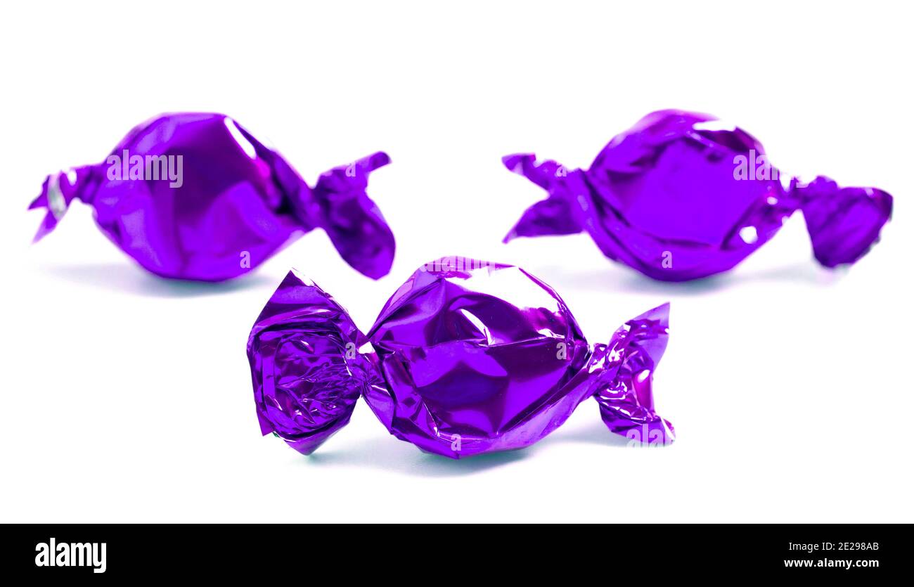 Three Purple Wrapped Candy Isolated on a White Background Stock Photo ...