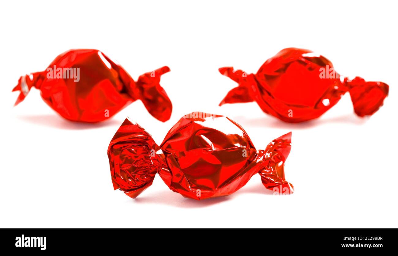 Three Red Wrapped Candy Isolated on a White Background Stock Photo - Alamy