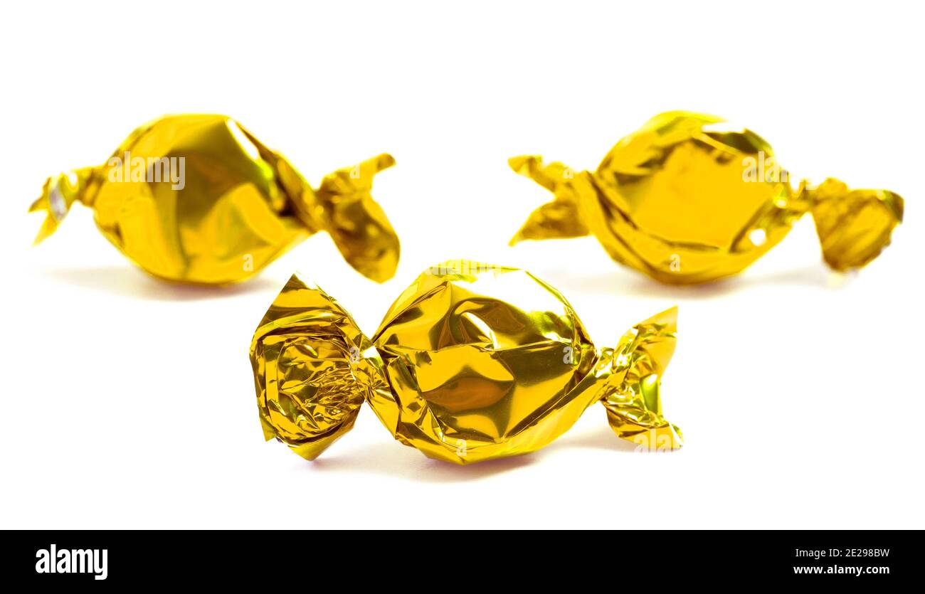 Three Golden Wrapped Candy Isolated on a White Background Stock Photo ...