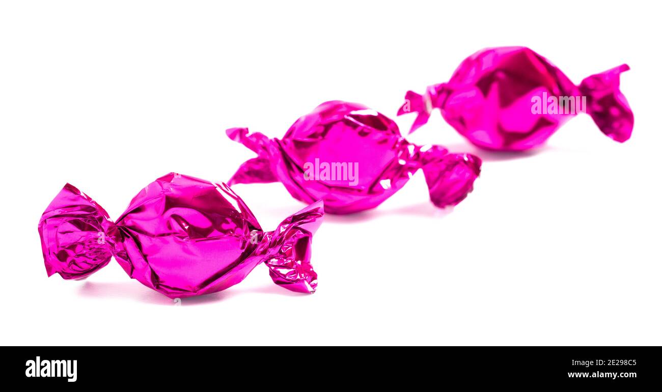 Three Pink Wrapped Candy Isolated on a White Background Stock Photo - Alamy