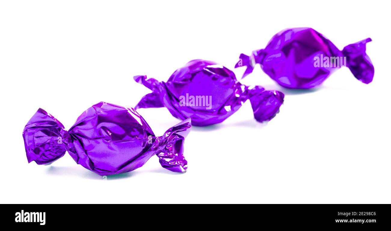 Three Purple Wrapped Candy Isolated on a White Background Stock Photo ...