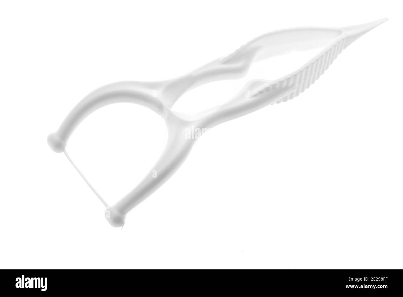 A floss pick for teeth and gums on an isolated background Stock Photo ...