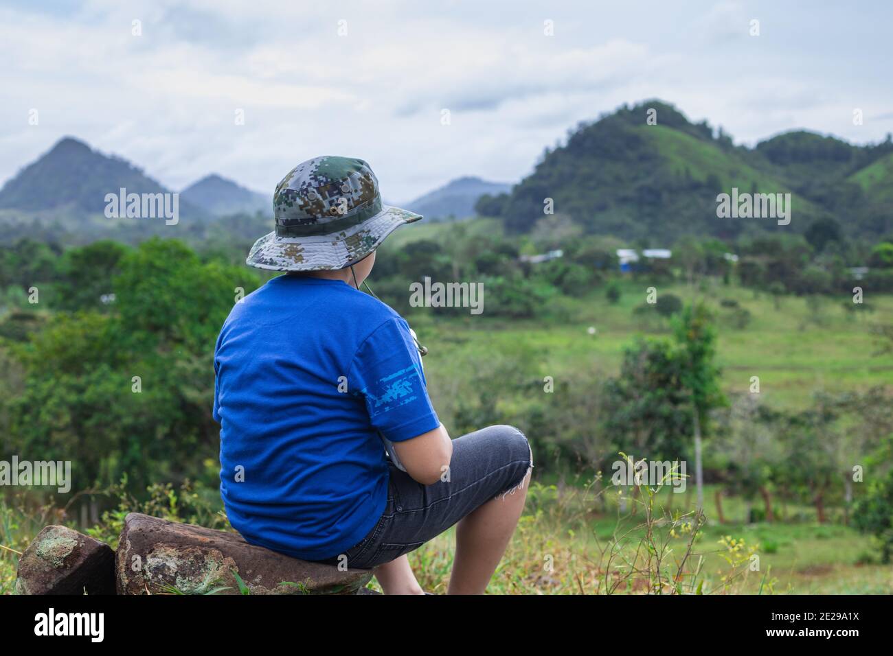 Children sitting thinking outside hi-res stock photography and images ...