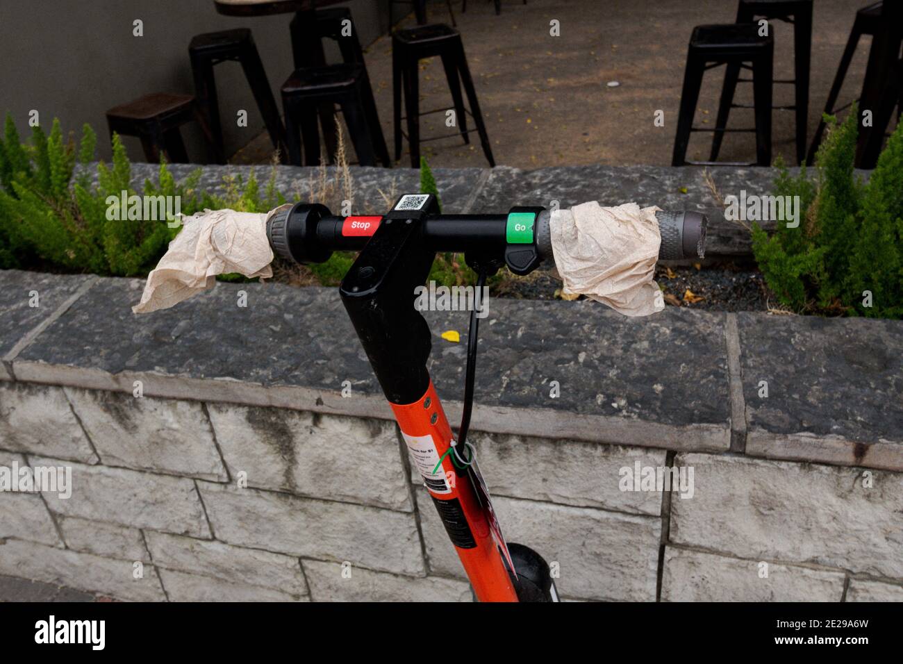 Rubber gloves stuck on a scooter handle Stock Photo - Alamy