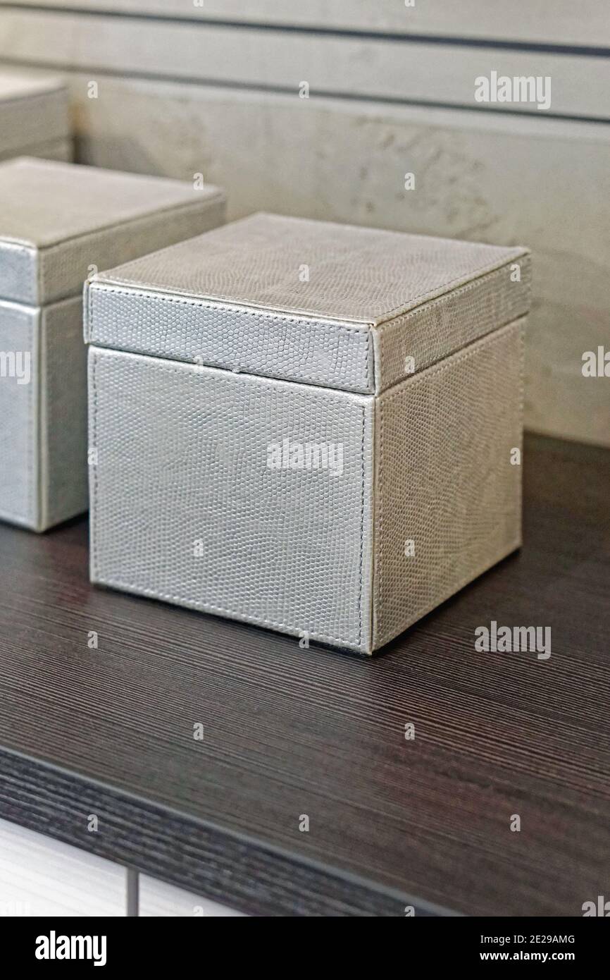 Decorative white box with lid at wooden shelf Stock Photo - Alamy