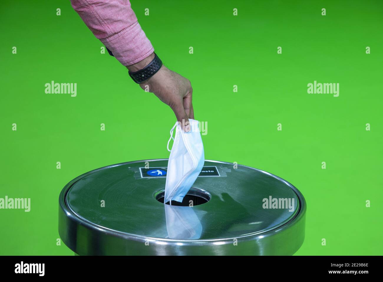 Medical mask throws into trash can Stock Photo - Alamy