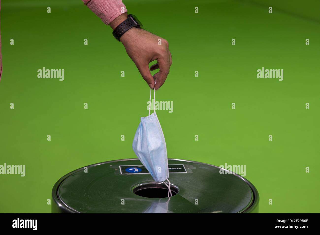 Dump face mask after use proper trash can, chroma video Stock Photo - Alamy