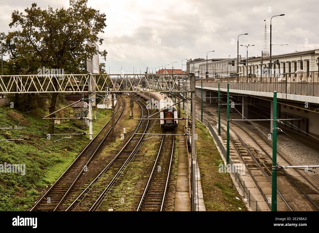POZNAN, POLAND - Oct 12, 2017: Old tracks with moving train in the city ...