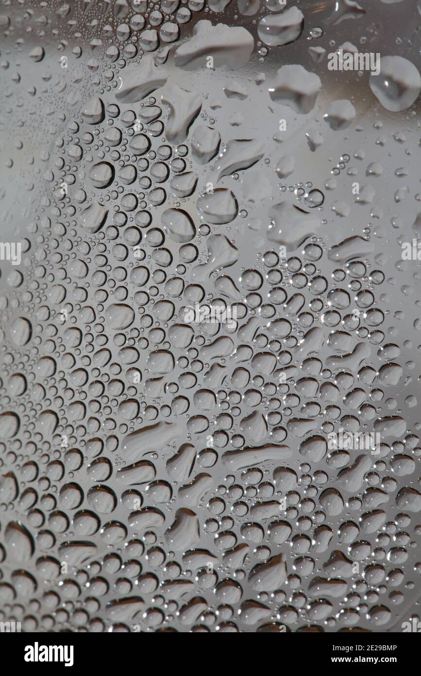Water drops in transparent bottle close up modern background high ...