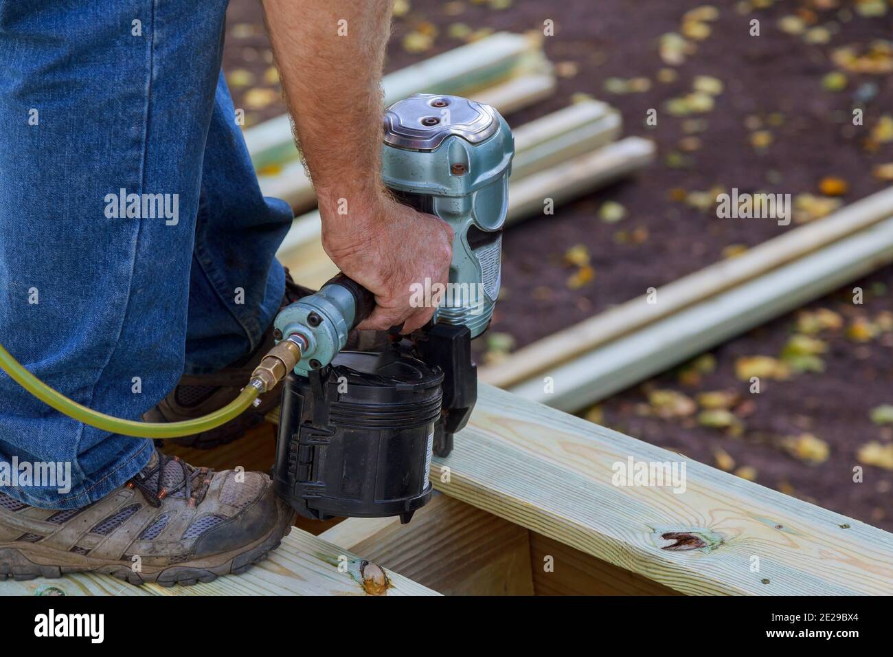 Installing wood floor for patio deck with new wooden decking fragment ...