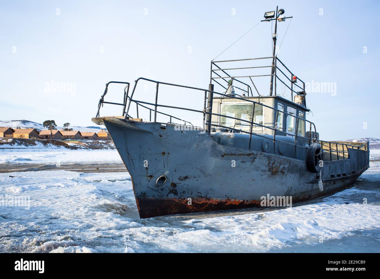 A Fishing Boat In Frozen Water Stock Photo - Alamy