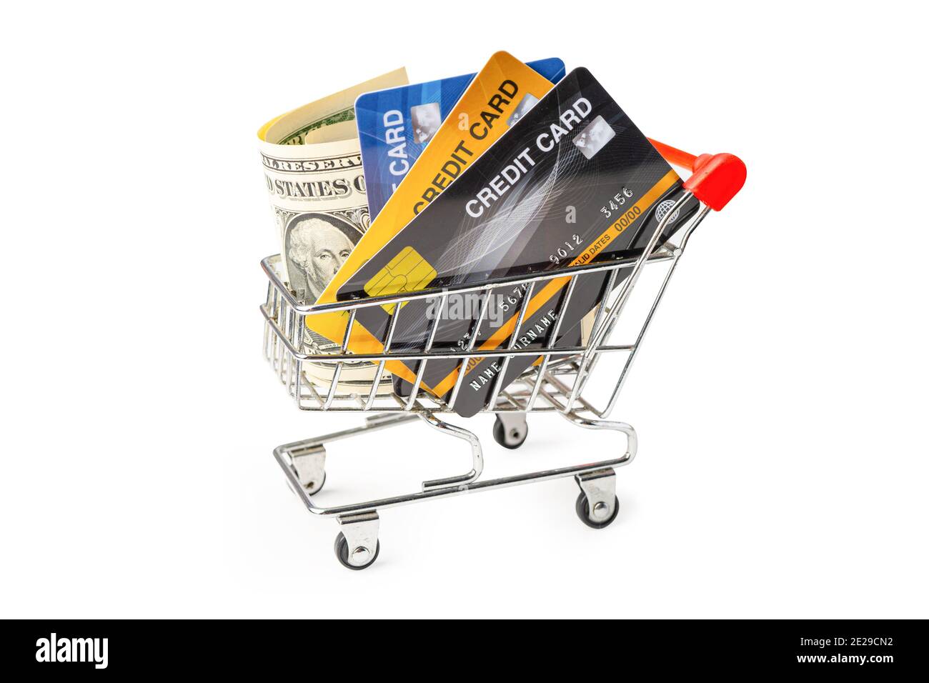 Credit card and US dollar banknotes in shopping cart isolated on white ...