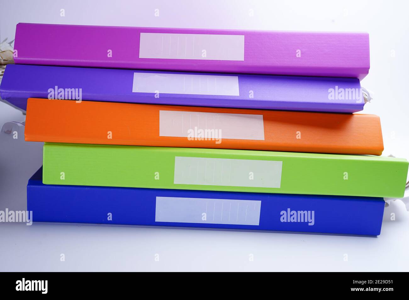 File Folder Binder stack of multi color on table in office Stock Photo ...