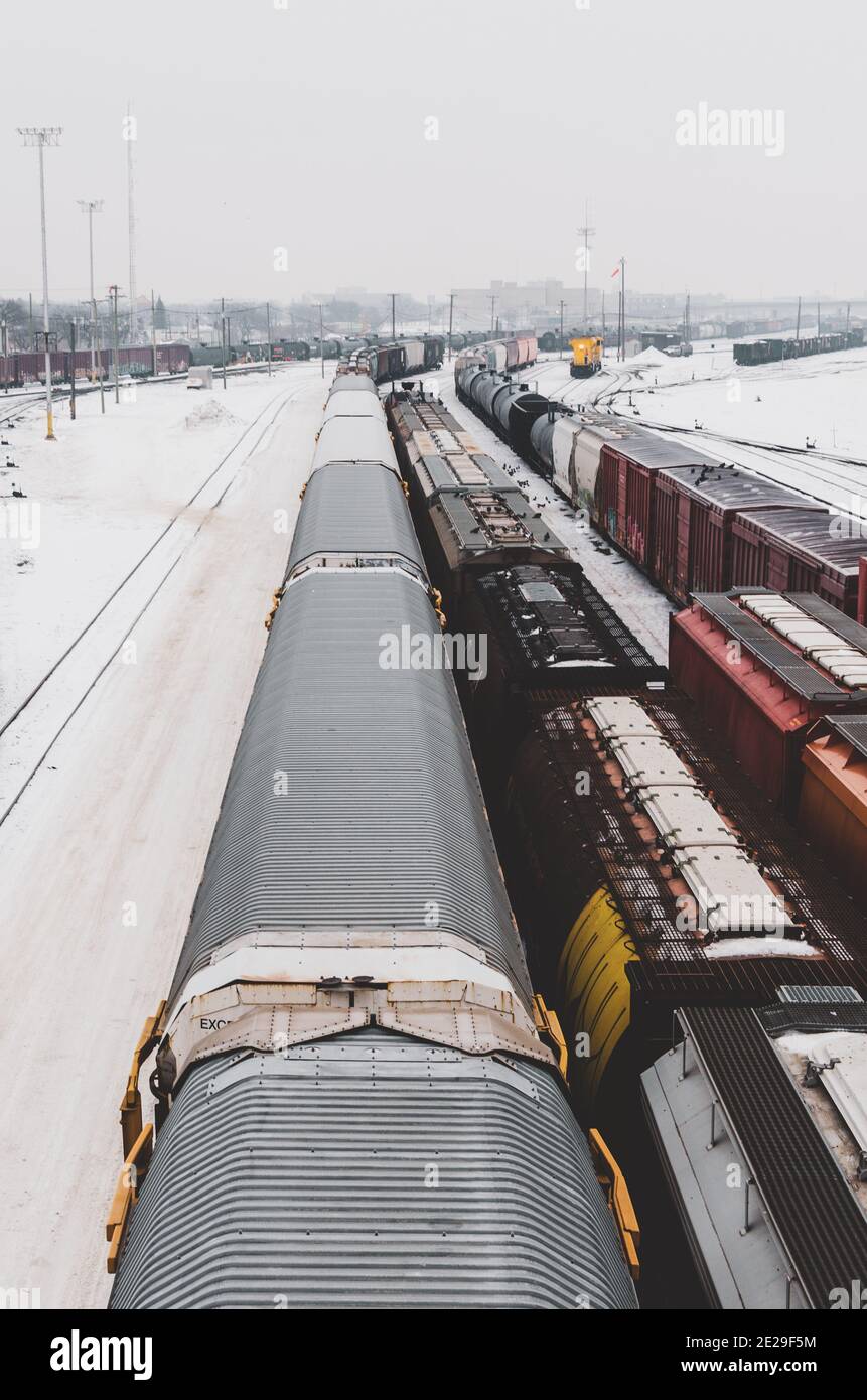 Trains at the CP Winnipeg Yard covered in snow on a cold January day ...