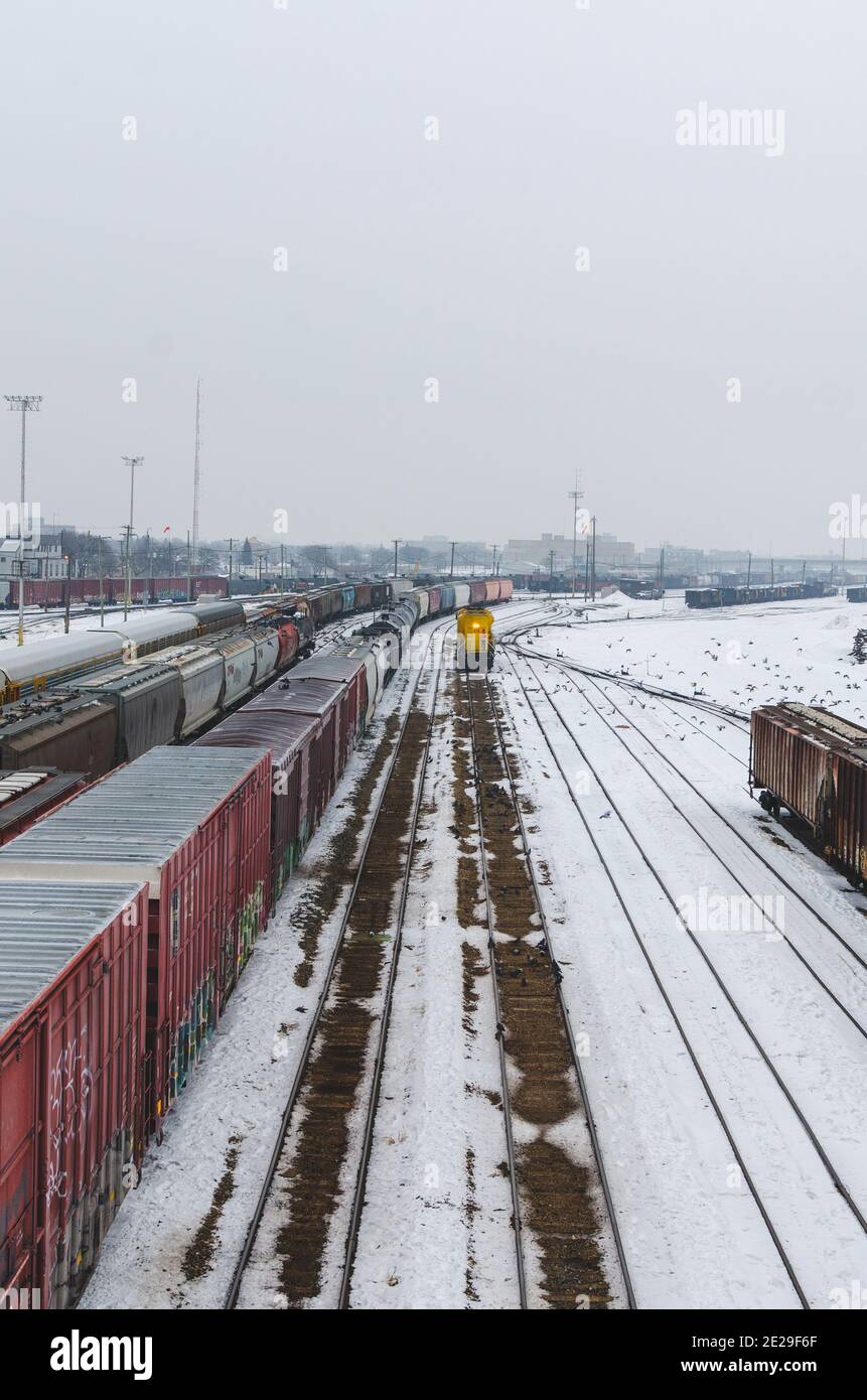 Trains at the CP Winnipeg Yard covered in snow on a cold January day ...