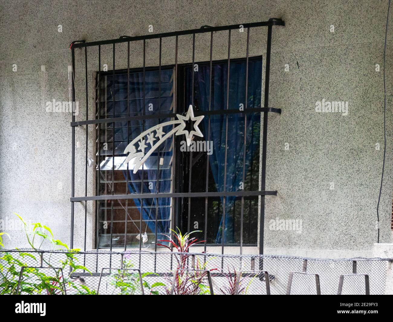 A White Star Surrounded by Lights Placed on a Window Stock Photo - Alamy